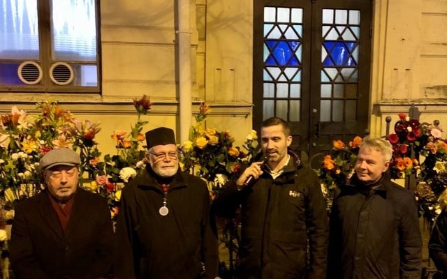 Fence of the Jewish Community Center in Helsinki adorned with flowers ...